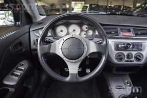Black Mitsubishi lancer-evolution 2001 in Riga, with an engine capacity of 2.00 L and mileage of 192 thousand km for 47500 €, photo 8 on AUTOMOTO.COM.LV