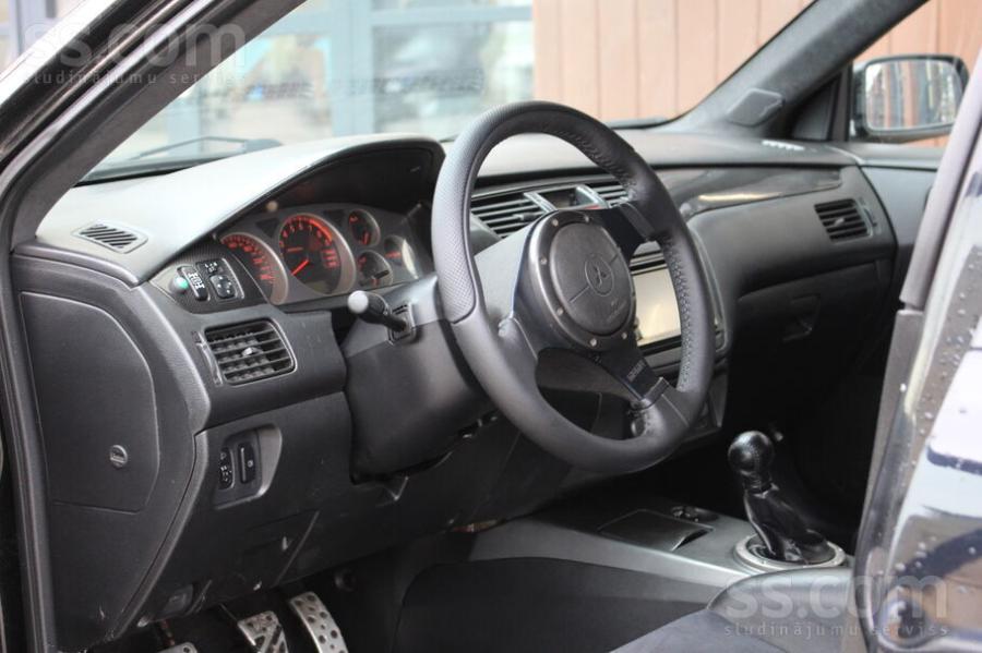 Melns Mitsubishi lancer-evolution 2006 Rīga, ar dzinēja tilpumu 2.00 L un nobraukumu 187 tūkst. km par 44950 €, foto 8 vietnē AUTOMOTO.COM.LV