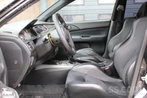 Melns Mitsubishi lancer-evolution 2006 Rīga, ar dzinēja tilpumu 2.00 L un nobraukumu 187 tūkst. km par 44950 €, foto 9 vietnē AUTOMOTO.COM.LV