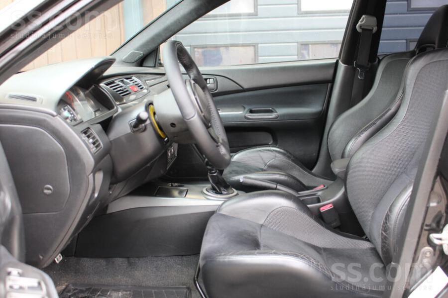 Melns Mitsubishi lancer-evolution 2006 Rīga, ar dzinēja tilpumu 2.00 L un nobraukumu 187 tūkst. km par 44950 €, foto 9 vietnē AUTOMOTO.COM.LV