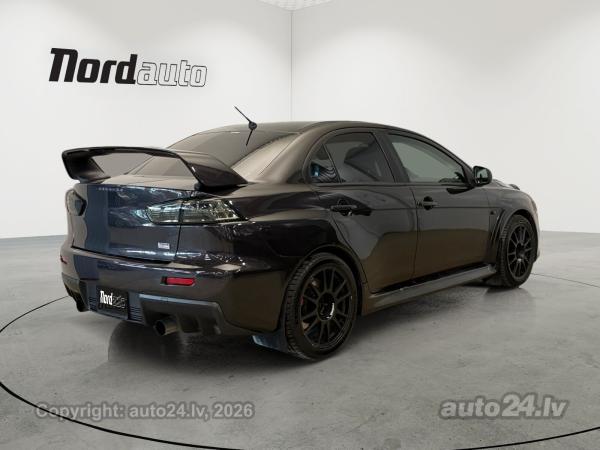 Melns Mitsubishi lancer-evolution 2010 Tallina, ar dzinēja tilpumu 2.00 L un nobraukumu 146 tūkst. km par 32900 €, foto 2 vietnē AUTOMOTO.COM.LV