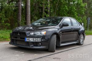 Melns Mitsubishi lancer-evolution 2012 Rīga, ar dzinēja tilpumu 2.00 L un nobraukumu 184 tūkst. km par 32000 €, foto  vietnē AUTOMOTO.COM.LV