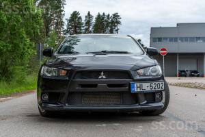 Melns Mitsubishi lancer-evolution 2012 Rīga, ar dzinēja tilpumu 2.00 L un nobraukumu 184 tūkst. km par 32000 €, foto 3 vietnē AUTOMOTO.COM.LV