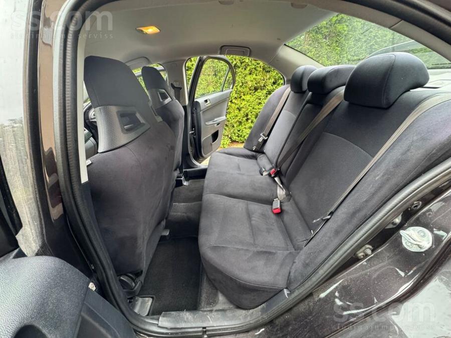 Melns Mitsubishi lancer-evolution 2012 Rīga, ar dzinēja tilpumu 2.00 L un nobraukumu 184 tūkst. km par 32000 €, foto 9 vietnē AUTOMOTO.COM.LV