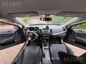 Melns Mitsubishi lancer-evolution 2012 Rīga, ar dzinēja tilpumu 2.00 L un nobraukumu 184 tūkst. km par 32000 €, foto 10 vietnē AUTOMOTO.COM.LV