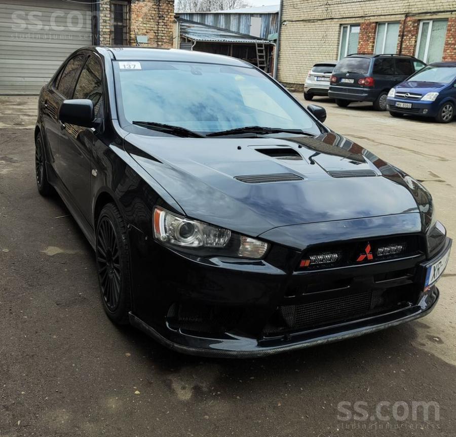 Melns Mitsubishi lancer-evolution 2011 Rīga, ar dzinēja tilpumu 2.00 L un nobraukumu 163 tūkst. km par 13500 €, foto 1 vietnē AUTOMOTO.COM.LV