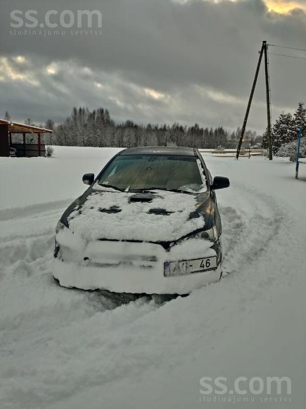 Black Mitsubishi lancer-evolution 2011 in Riga, with an engine capacity of 2.00 L and mileage of 163 thousand km for 13500 €, photo 2 on AUTOMOTO.COM.LV
