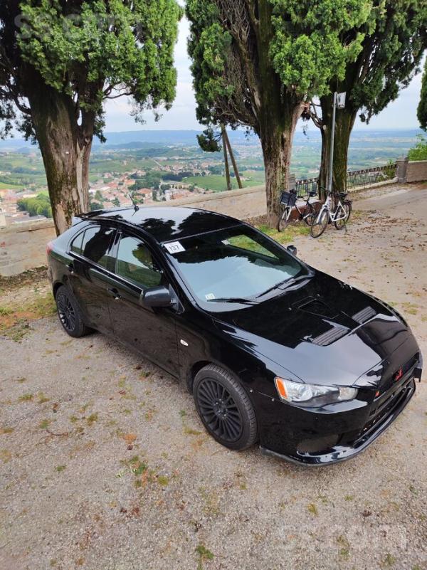 Black Mitsubishi lancer-evolution 2011 in Riga, with an engine capacity of 2.00 L and mileage of 163 thousand km for 13500 €, photo 4 on AUTOMOTO.COM.LV