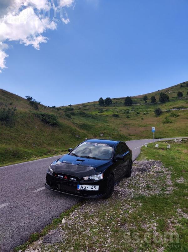 Black Mitsubishi lancer-evolution 2011 in Riga, with an engine capacity of 2.00 L and mileage of 163 thousand km for 13500 €, photo 5 on AUTOMOTO.COM.LV
