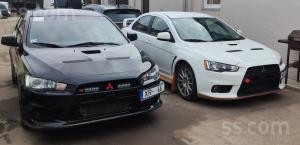 Melns Mitsubishi lancer-evolution 2011 Rīga, ar dzinēja tilpumu 2.00 L un nobraukumu 163 tūkst. km par 13500 €, foto 6 vietnē AUTOMOTO.COM.LV