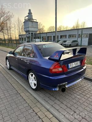Blue Mitsubishi lancer-evolution 1996 in Ventspils, with an engine capacity of 2.00 L and mileage of 166 thousand km for 19500 €, photo 13 on AUTOMOTO.COM.LV