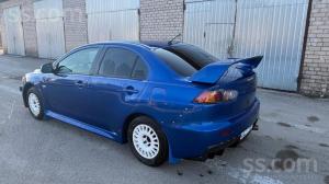 Blue Mitsubishi lancer-evolution 2010 in Saldus, with an engine capacity of 2.00 L and mileage of 160 thousand km for 22385 €, photo 4 on AUTOMOTO.COM.LV