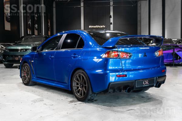 Zils Mitsubishi lancer-evolution 2012 Rīga, ar dzinēja tilpumu 2.00 L un nobraukumu 185 tūkst. km par 37500 €, foto 6 vietnē AUTOMOTO.COM.LV