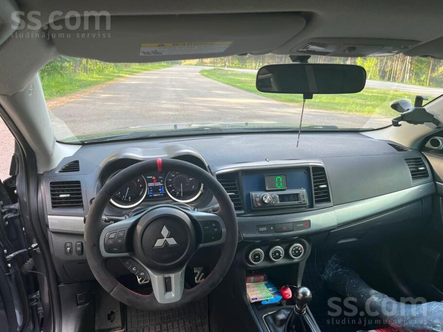 Pelēks Mitsubishi lancer-evolution 2010 Rīga, ar dzinēja tilpumu 2.00 L un nobraukumu 150 tūkst. km par 24000 €, foto 4 vietnē AUTOMOTO.COM.LV