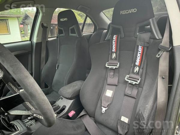 Pelēks Mitsubishi lancer-evolution 2010 Rīga, ar dzinēja tilpumu 2.00 L un nobraukumu 150 tūkst. km par 24000 €, foto 5 vietnē AUTOMOTO.COM.LV