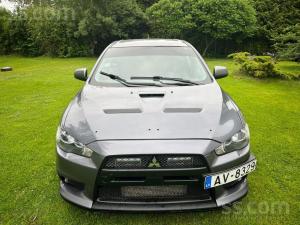 Pelēks Mitsubishi lancer-evolution 2010 Rīga, ar dzinēja tilpumu 2.00 L un nobraukumu 150 tūkst. km par 24000 €, foto 10 vietnē AUTOMOTO.COM.LV