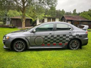 Pelēks Mitsubishi lancer-evolution 2010 Rīga, ar dzinēja tilpumu 2.00 L un nobraukumu 150 tūkst. km par 24000 €, foto 12 vietnē AUTOMOTO.COM.LV