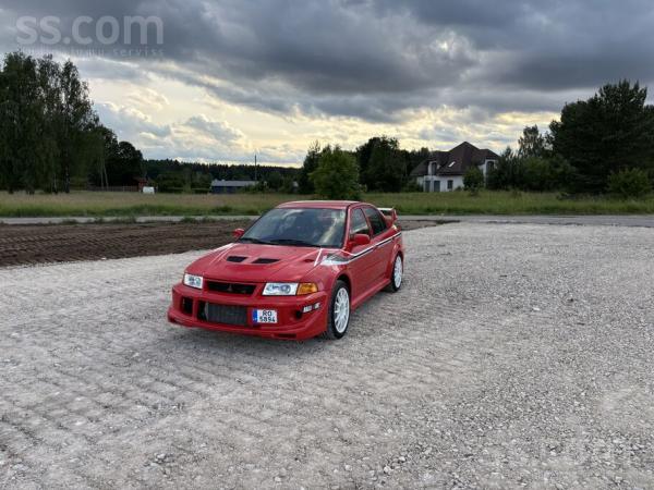 Red Mitsubishi lancer-evolution 1999 in Riga, with an engine capacity of 2.00 L and mileage of 141 thousand km for 47000 €, photo 2 on AUTOMOTO.COM.LV