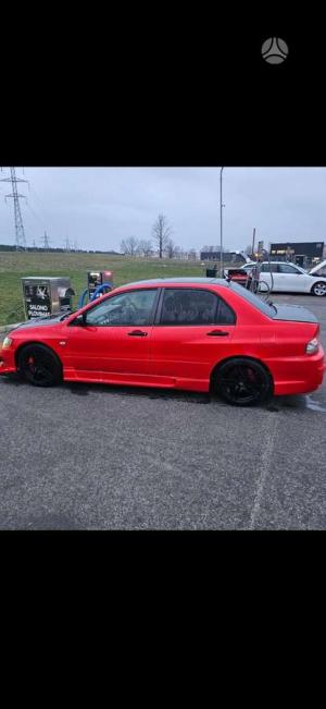 Red Mitsubishi lancer-evolution 2002 in Kaunas, with an engine capacity of 2.00 L and mileage of 135 thousand km for 13500 €, photo 5 on AUTOMOTO.COM.LV