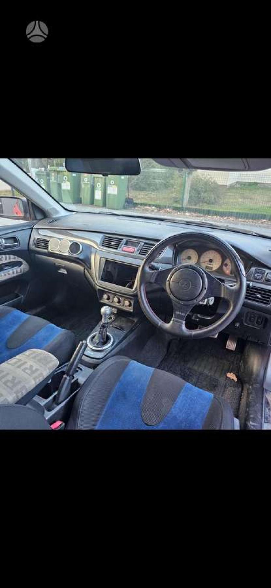 Red Mitsubishi lancer-evolution 2002 in Kaunas, with an engine capacity of 2.00 L and mileage of 135 thousand km for 13500 €, photo 7 on AUTOMOTO.COM.LV