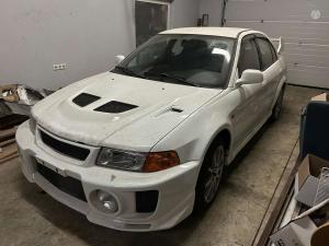 Balts Mitsubishi lancer-evolution 1998 Panevēža, ar dzinēja tilpumu 2.00 L un nobraukumu 131 tūkst. km par 27000 €, foto  vietnē AUTOMOTO.COM.LV