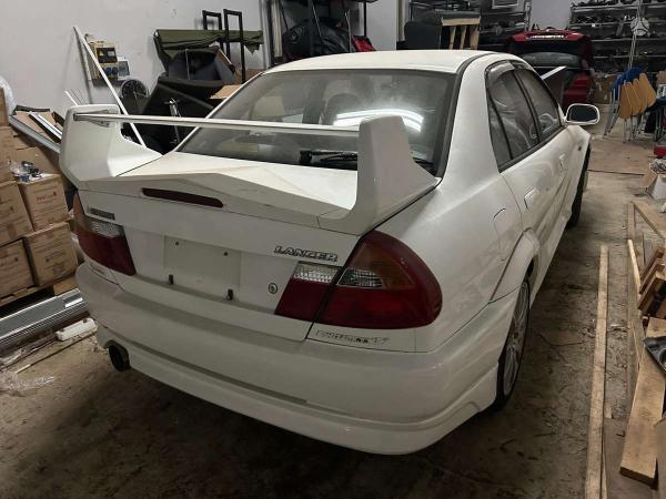 White Mitsubishi lancer-evolution 1998 in Panevezys, with an engine capacity of 2.00 L and mileage of 131 thousand km for 27000 €, photo 3 on AUTOMOTO.COM.LV