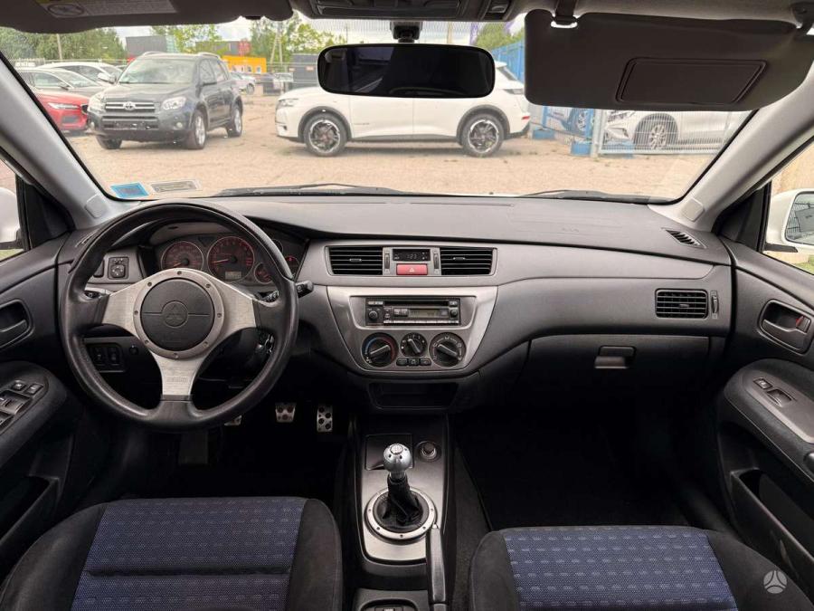 Balts Mitsubishi lancer-evolution 2003 Panevēža, ar dzinēja tilpumu 2.00 L un nobraukumu 107 tūkst. km par 31500 €, foto 19 vietnē AUTOMOTO.COM.LV