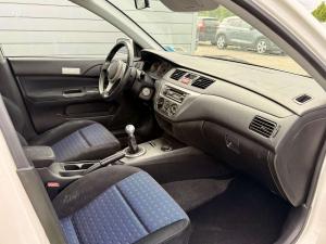 Balts Mitsubishi lancer-evolution 2003 Panevēža, ar dzinēja tilpumu 2.00 L un nobraukumu 107 tūkst. km par 31500 €, foto 25 vietnē AUTOMOTO.COM.LV