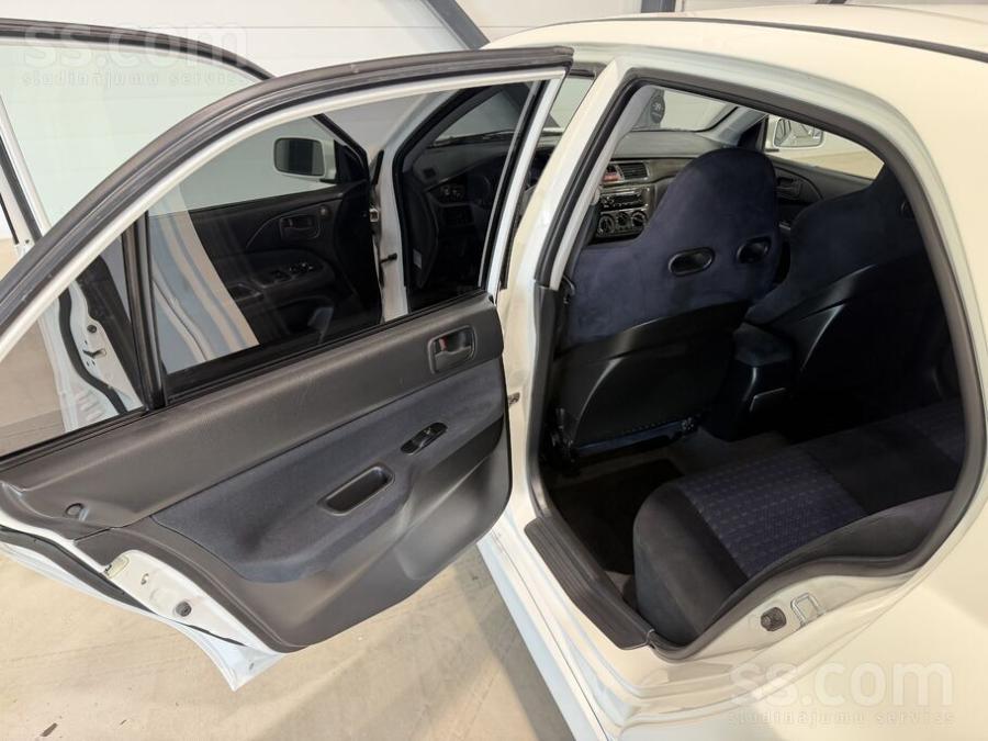 Balts Mitsubishi lancer-evolution 2005 Rīga, ar dzinēja tilpumu 2.00 L un nobraukumu 55 tūkst. km par 36999 €, foto 12 vietnē AUTOMOTO.COM.LV