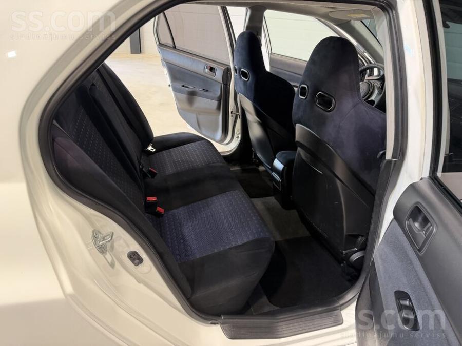 Balts Mitsubishi lancer-evolution 2005 Rīga, ar dzinēja tilpumu 2.00 L un nobraukumu 55 tūkst. km par 36999 €, foto 13 vietnē AUTOMOTO.COM.LV