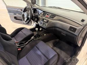 Balts Mitsubishi lancer-evolution 2005 Rīga, ar dzinēja tilpumu 2.00 L un nobraukumu 55 tūkst. km par 36999 €, foto 15 vietnē AUTOMOTO.COM.LV