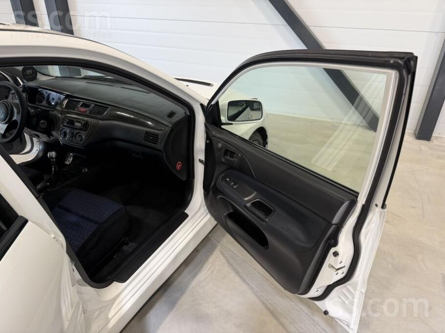 Balts Mitsubishi lancer-evolution 2005 Rīga, ar dzinēja tilpumu 2.00 L un nobraukumu 55 tūkst. km par 36999 €, foto 16 vietnē AUTOMOTO.COM.LV