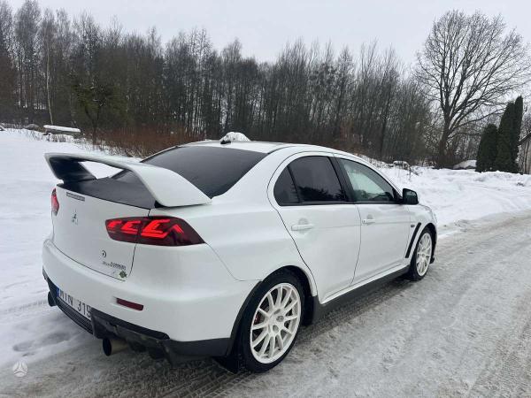 White Mitsubishi lancer-evolution 2008 in Kaunas, with an engine capacity of 2.00 L and mileage of 196 thousand km for 29500 €, photo 7 on AUTOMOTO.COM.LV
