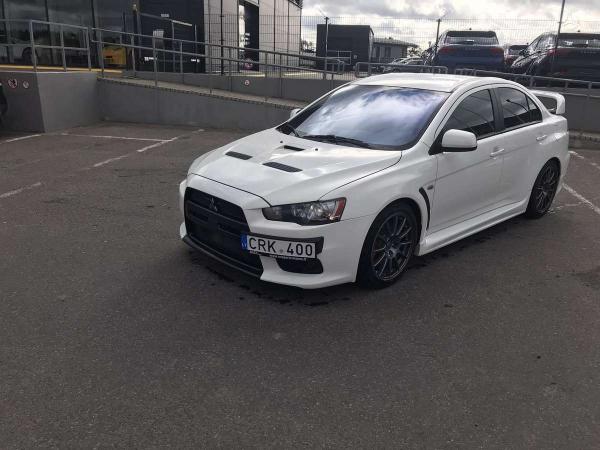 White Mitsubishi lancer-evolution 2010 in Vilnius, with an engine capacity of 2.00 L and mileage of 152 thousand km for 21000 €, photo 3 on AUTOMOTO.COM.LV