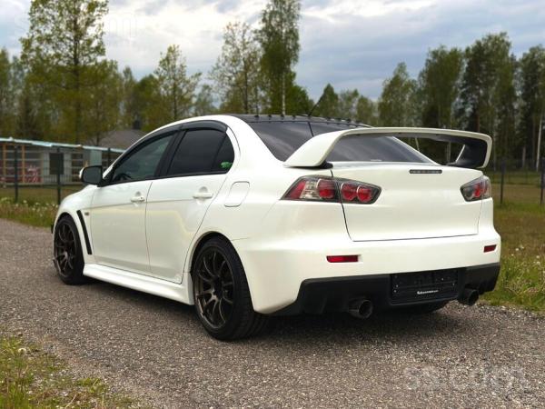 Balts Mitsubishi lancer-evolution 2011 Ogre, ar dzinēja tilpumu 2.00 L un nobraukumu 64 tūkst. km par 24500 €, foto 5 vietnē AUTOMOTO.COM.LV