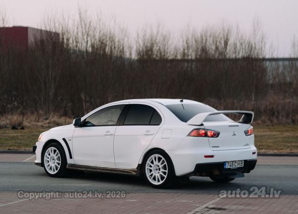 White Mitsubishi lancer-evolution 2012 in Tallinn, with an engine capacity of 2.00 L and mileage of 127 thousand km for 42900 €, photo 5 on AUTOMOTO.COM.LV