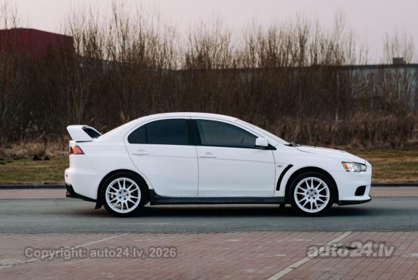 White Mitsubishi lancer-evolution 2012 in Tallinn, with an engine capacity of 2.00 L and mileage of 127 thousand km for 42900 €, photo 8 on AUTOMOTO.COM.LV