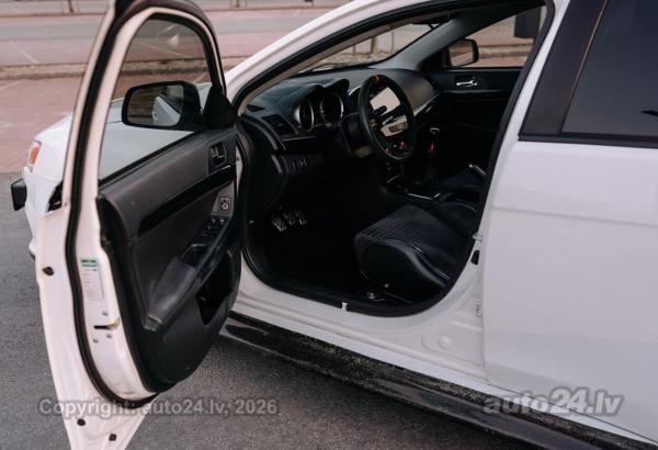 White Mitsubishi lancer-evolution 2012 in Tallinn, with an engine capacity of 2.00 L and mileage of 127 thousand km for 42900 €, photo 10 on AUTOMOTO.COM.LV
