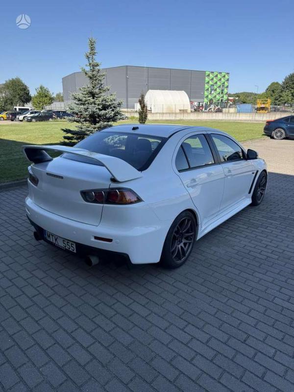 Balts Mitsubishi lancer-evolution 2015 Kauņa, ar dzinēja tilpumu 2.00 L un nobraukumu 240 tūkst. km par 25500 €, foto 3 vietnē AUTOMOTO.COM.LV