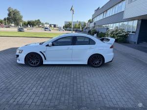 White Mitsubishi lancer-evolution 2015 in Kaunas, with an engine capacity of 2.00 L and mileage of 240 thousand km for 25500 €, photo 7 on AUTOMOTO.COM.LV