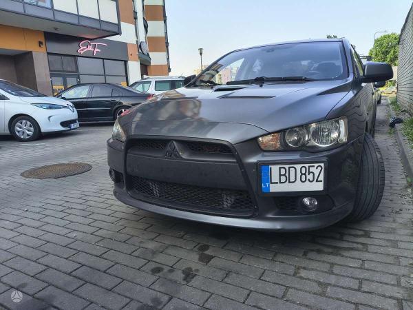 Pelēks Mitsubishi Lancer 2009 Panevēža, ar dzinēja tilpumu 1.97 L un nobraukumu 300 tūkst. km par 3000 €, foto 1 vietnē AUTOMOTO.COM.LV