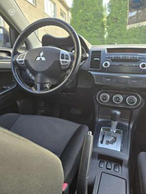 Pelēks Mitsubishi Lancer 2010 Viļņa, ar dzinēja tilpumu 1.80 L un nobraukumu 104 tūkst. km par 4000 €, foto 7 vietnē AUTOMOTO.COM.LV