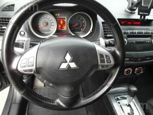 Pelēks Mitsubishi Lancer 2010 Rīga, ar dzinēja tilpumu 1.80 L un nobraukumu 185 tūkst. km par 3550 €, foto 12 vietnē AUTOMOTO.COM.LV