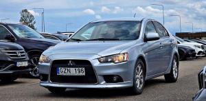 Grey Mitsubishi Lancer 2014 in Vilnius, with an engine capacity of 1.59 L and mileage of 128 thousand km for 4950 €, photo  on AUTOMOTO.COM.LV