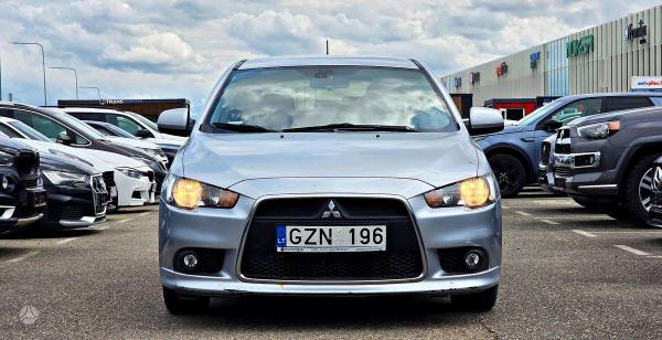 Grey Mitsubishi Lancer 2014 in Vilnius, with an engine capacity of 1.59 L and mileage of 128 thousand km for 4950 €, photo 3 on AUTOMOTO.COM.LV