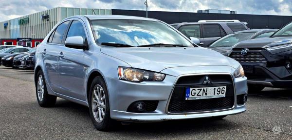 Grey Mitsubishi Lancer 2014 in Vilnius, with an engine capacity of 1.59 L and mileage of 128 thousand km for 4950 €, photo 4 on AUTOMOTO.COM.LV