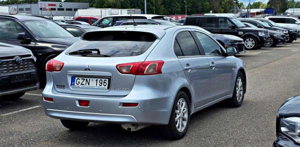 Grey Mitsubishi Lancer 2014 in Vilnius, with an engine capacity of 1.59 L and mileage of 128 thousand km for 4950 €, photo 5 on AUTOMOTO.COM.LV