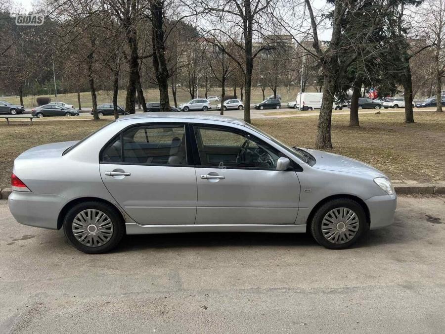 Grey Mitsubishi Lancer 2004 in Vilnius, with an engine capacity of 1.60 L and mileage of 149 thousand km for 850 €, photo 2 on AUTOMOTO.COM.LV