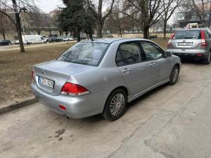 Grey Mitsubishi Lancer 2004 in Vilnius, with an engine capacity of 1.60 L and mileage of 149 thousand km for 850 €, photo 3 on AUTOMOTO.COM.LV