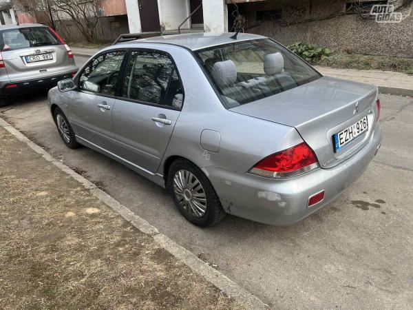 Grey Mitsubishi Lancer 2004 in Vilnius, with an engine capacity of 1.60 L and mileage of 149 thousand km for 850 €, photo 4 on AUTOMOTO.COM.LV
